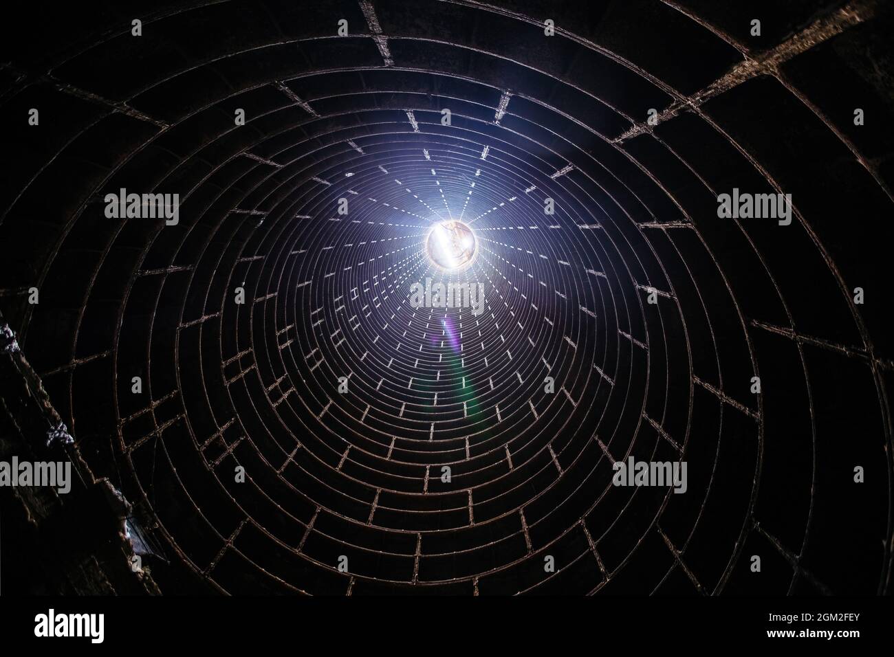 Vertical tubing shaft. Abstract light at the end of tube tunnel Stock ...
