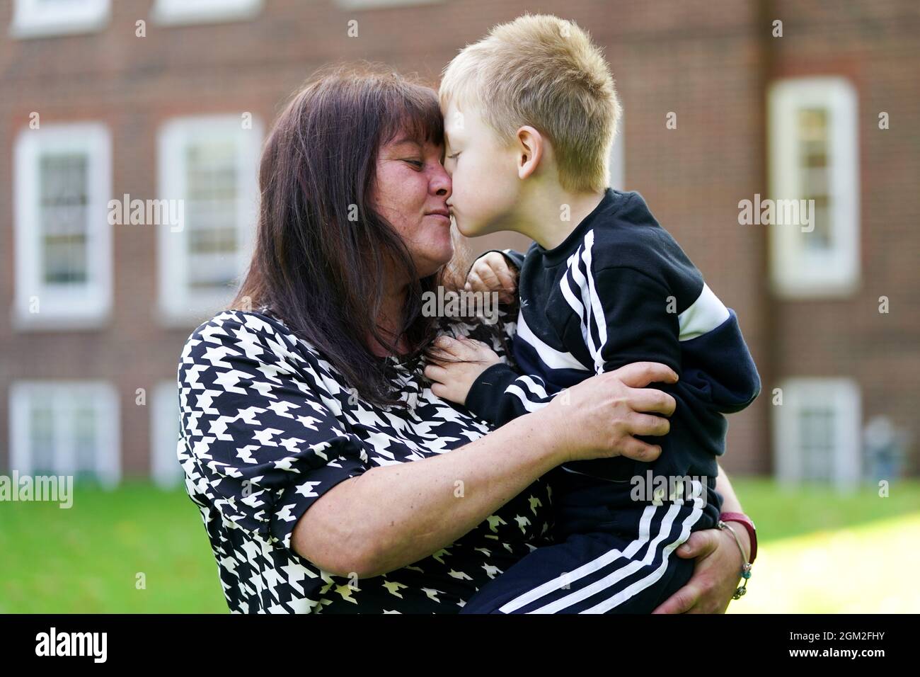 Rebecca Currie and her son Mathew Richards in the gardens of the ...