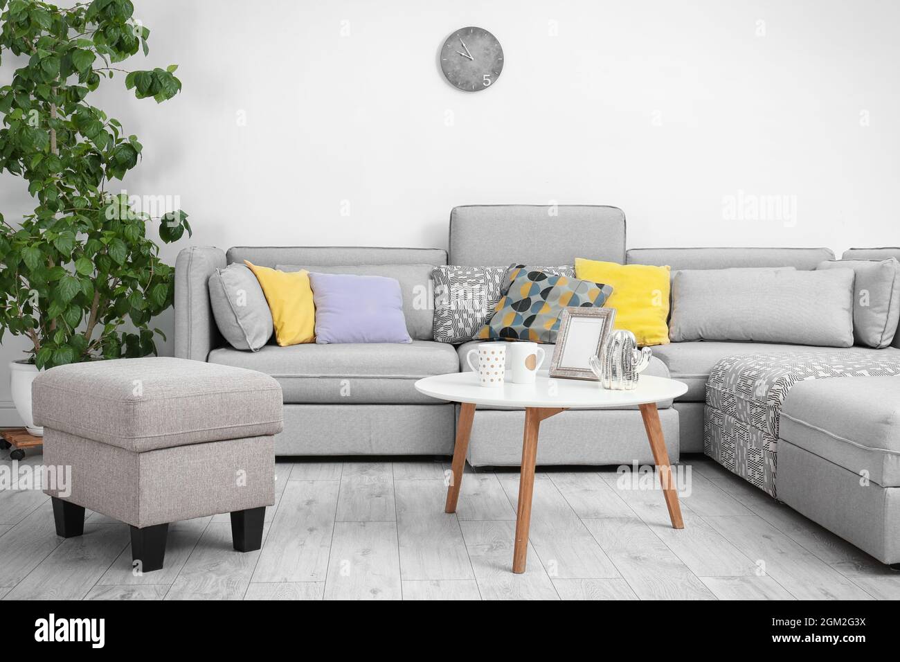 Living room interior with large grey couch Stock Photo - Alamy