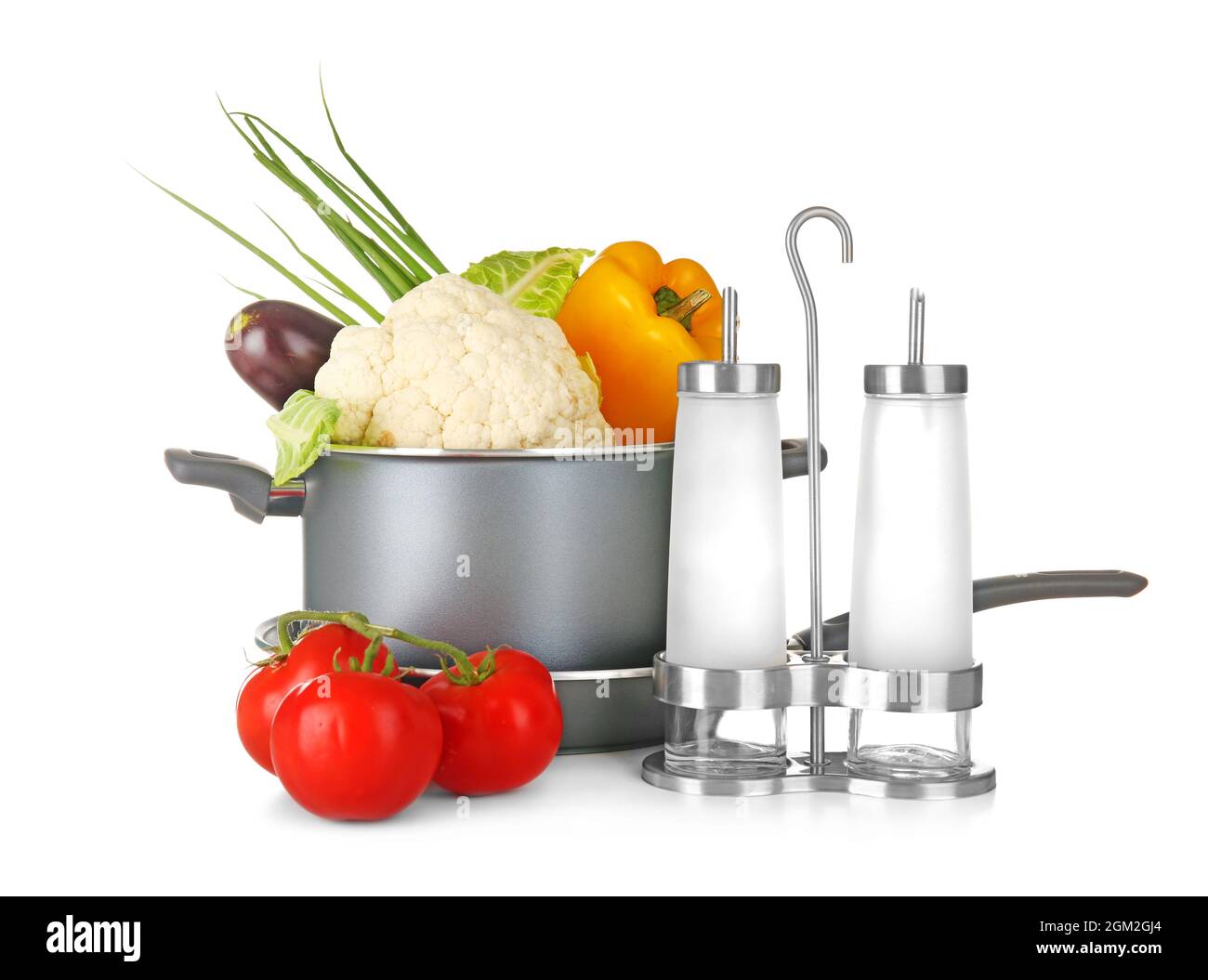 Different cooking utensils with vegetables on white background Stock ...