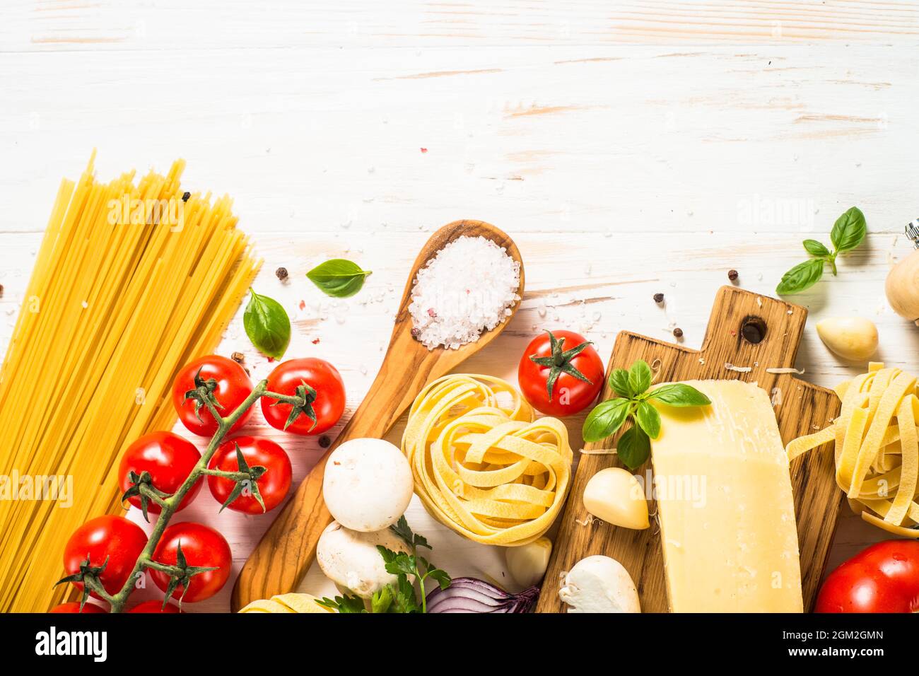 Italian food background at white bkitchen table Stock Photo - Alamy