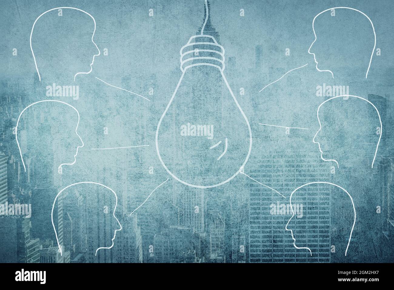 Silhouettes of heads are connected to a light bulb Stock Photo - Alamy