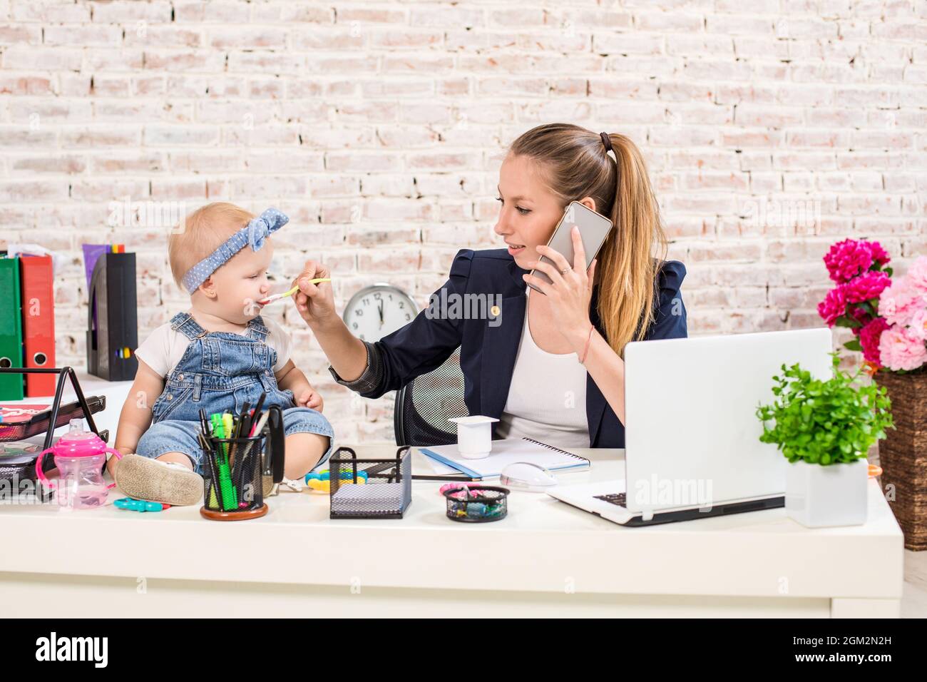 Family Business - telecommute Businesswoman and mother with kid is ...