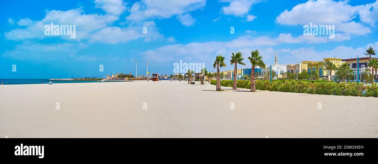 Panorama of the picturesque white sand Jumeirah beach with lush ...