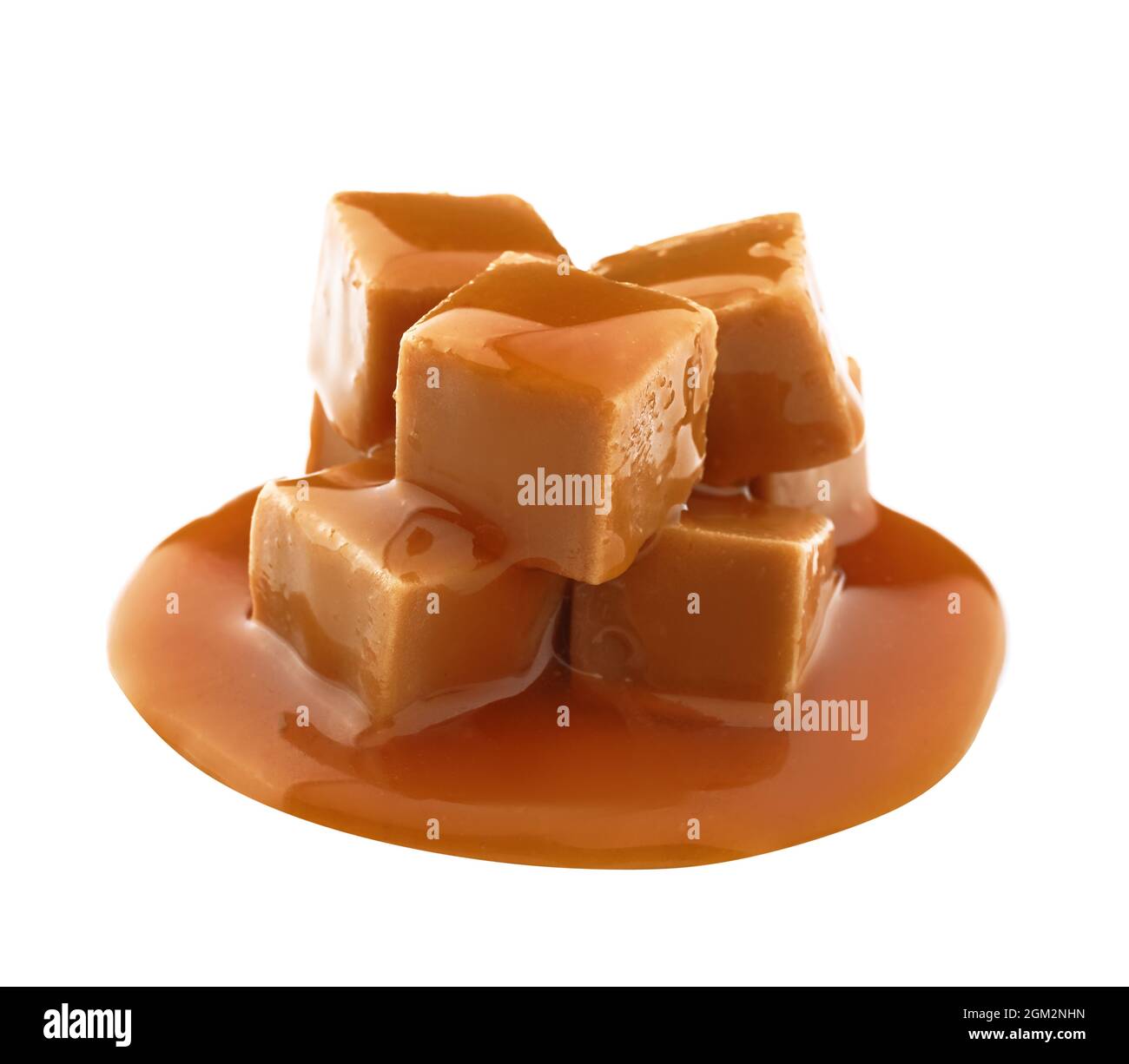 Delicious candies with caramel sauce on white background Stock Photo ...