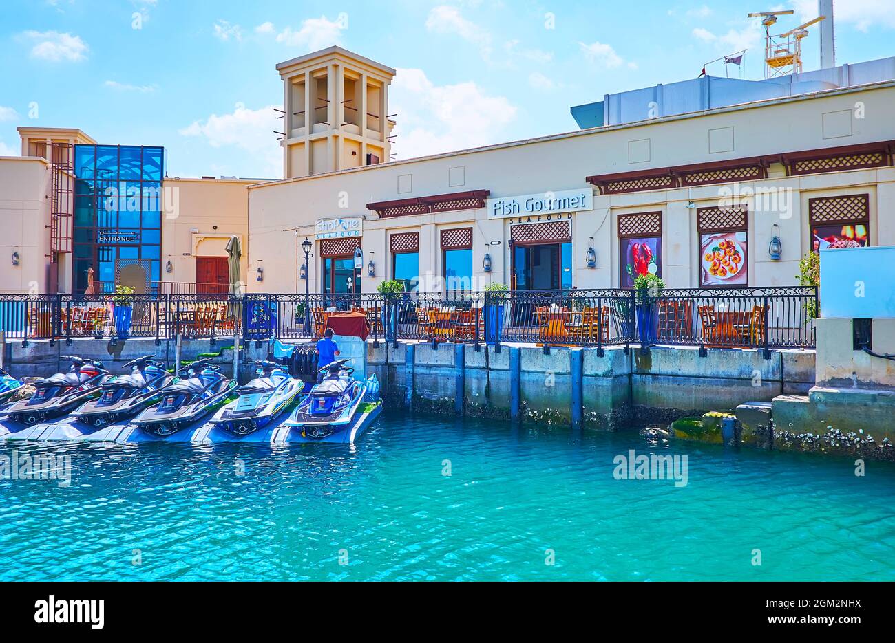 DUBAI, UAE - MARCH 4, 2020: The pier of Jumeirah fishing harbour with ...