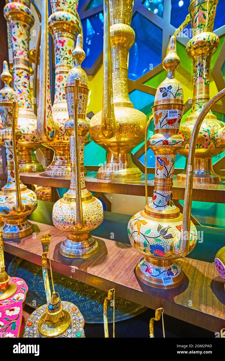 The close-up view of the ornate dallah coffee pots, decorated with ...
