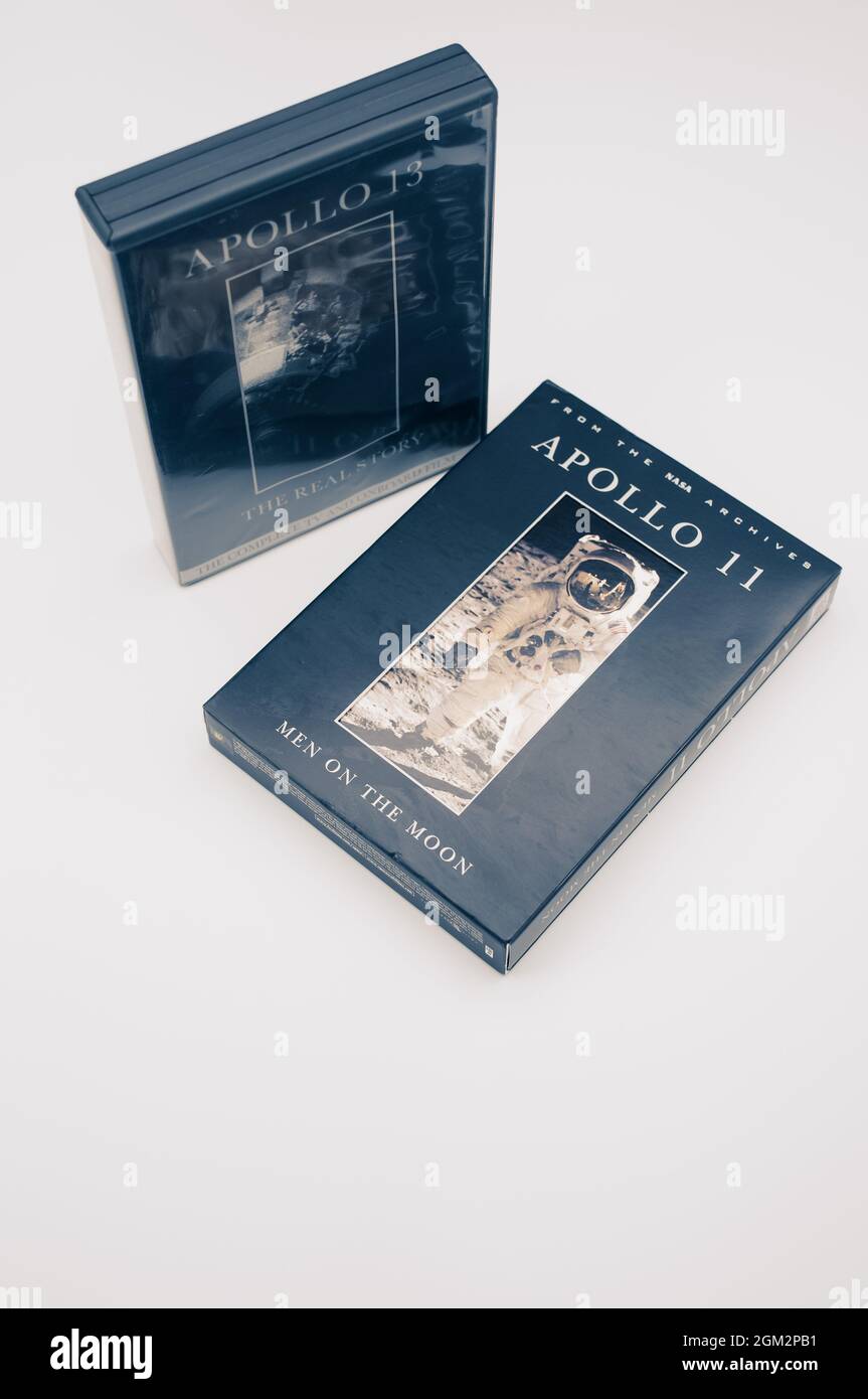 Apollo 11 and 13 moon mission documentary DVD media on a blank surface ...