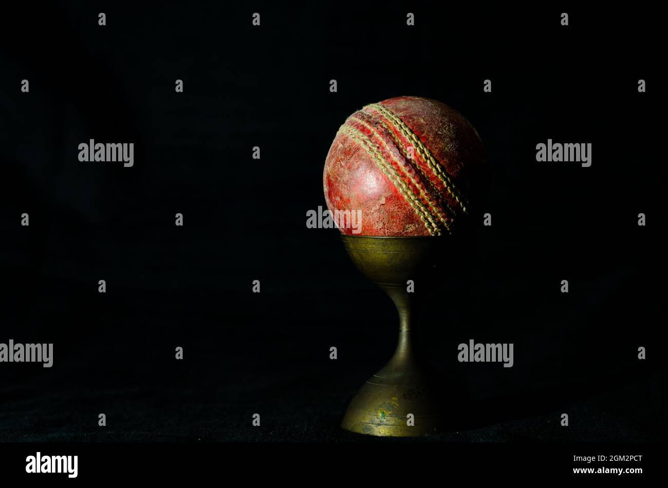 Used Season Cricket ball as trophy Stock Photo - Alamy