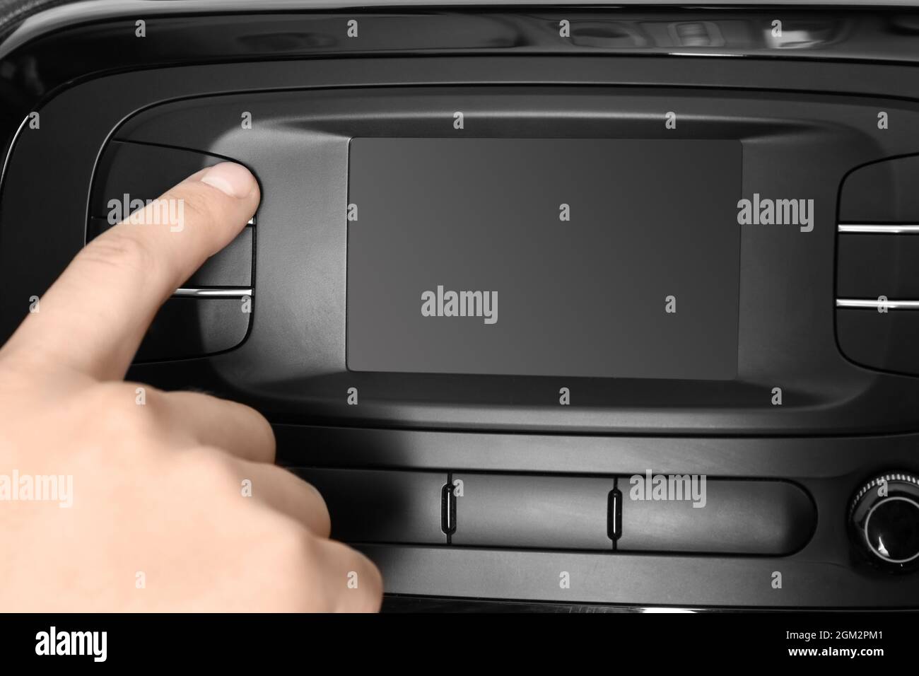 Man tuning radio in car Stock Photo - Alamy