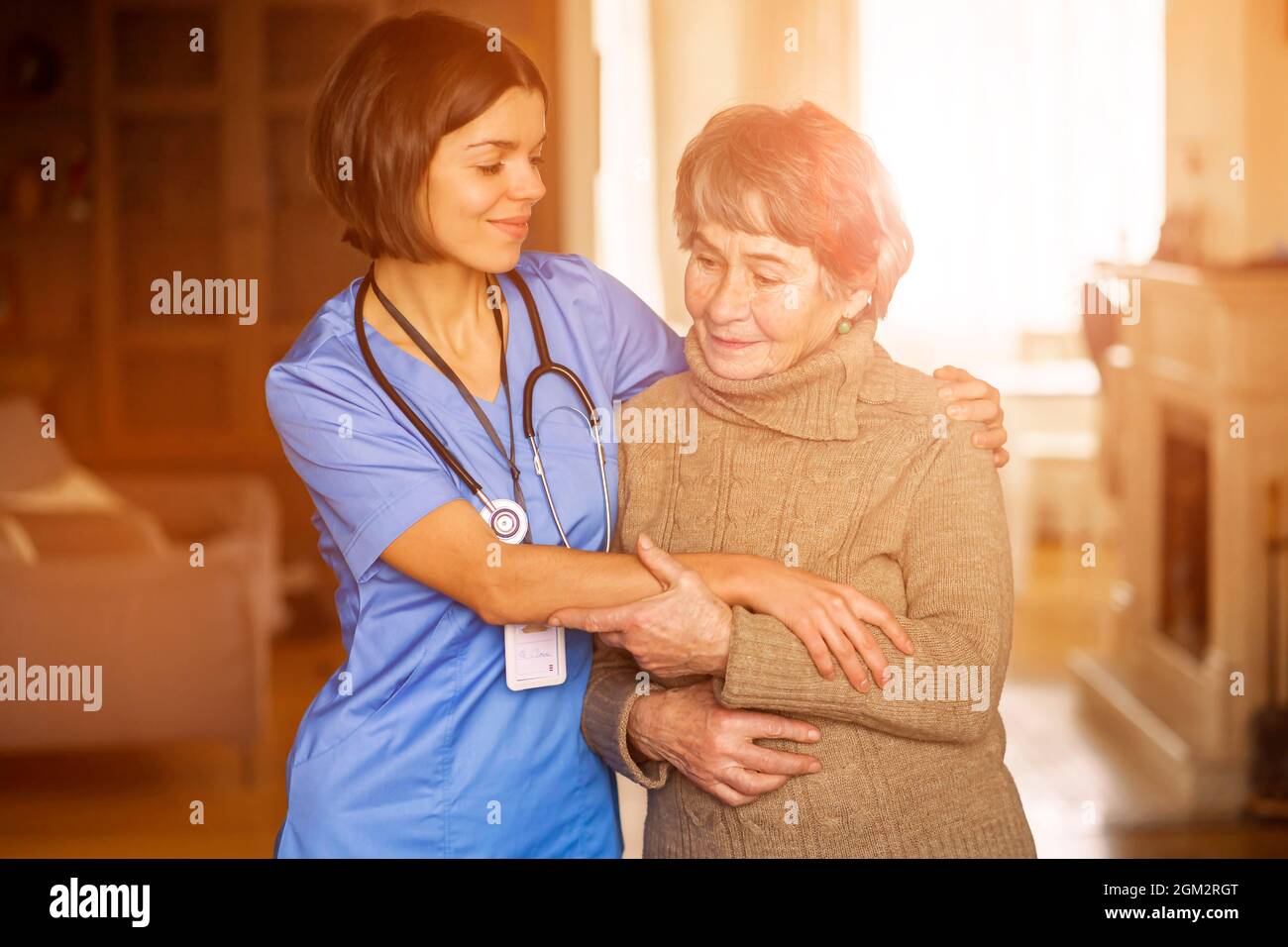 A young nurse shows care and professionalism in relation to an elderly ...