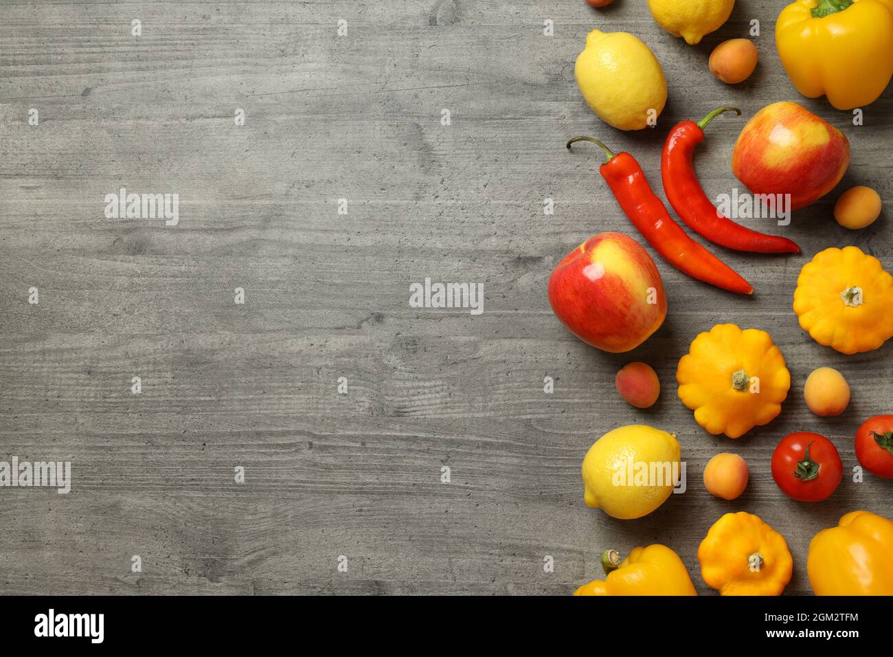 Set of different vegetables and fruits on gray textured background ...
