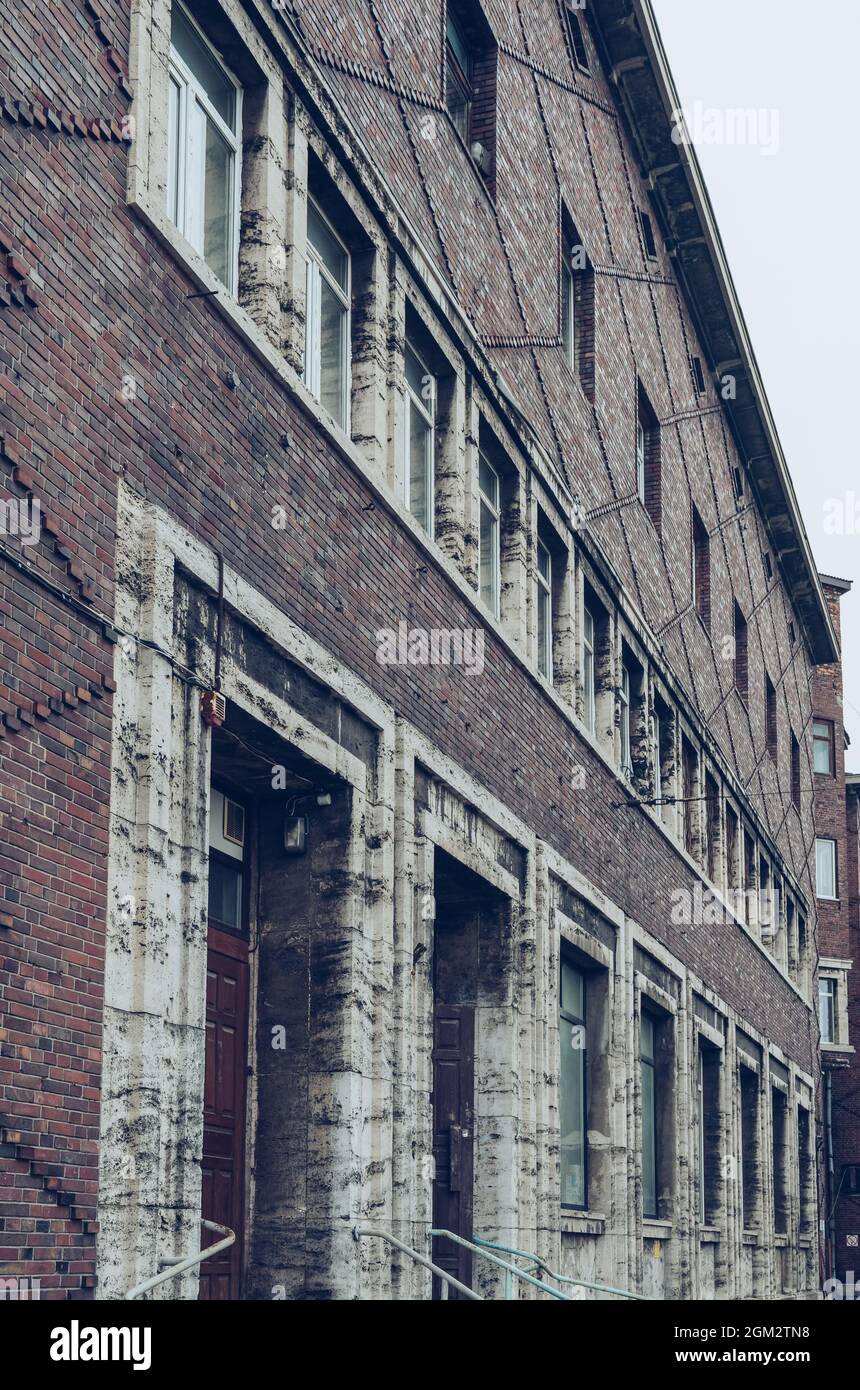 perspective view of old brick building on gloomy day Stock Photo - Alamy