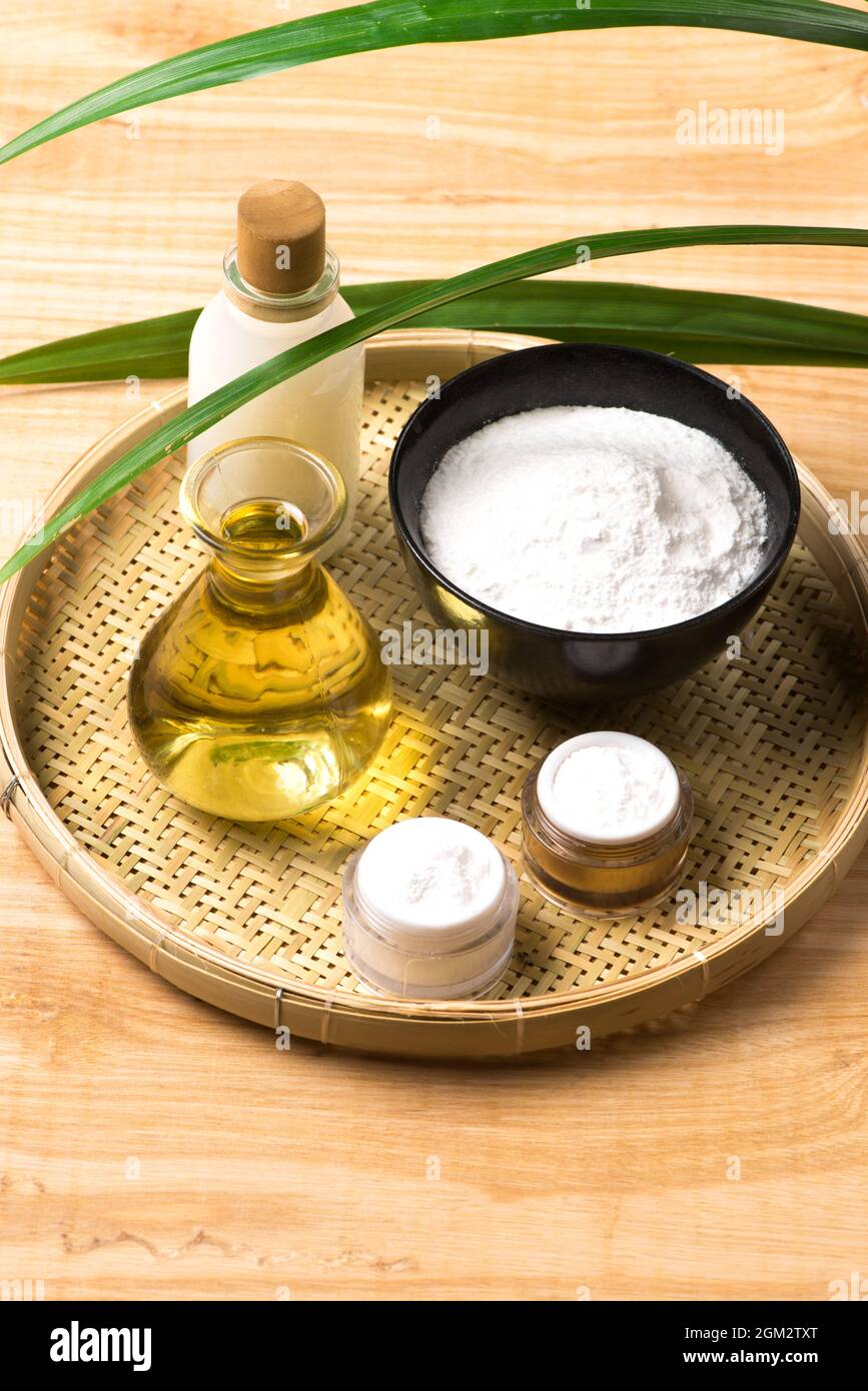 Rice bran oil extract and brown rice on wood table background Stock ...