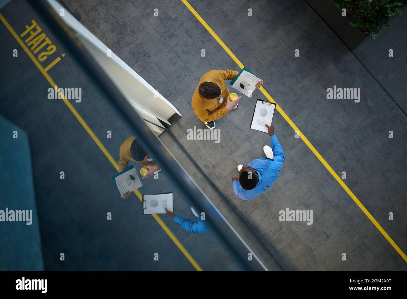 Two managers are talking in IT office, top view Stock Photo - Alamy