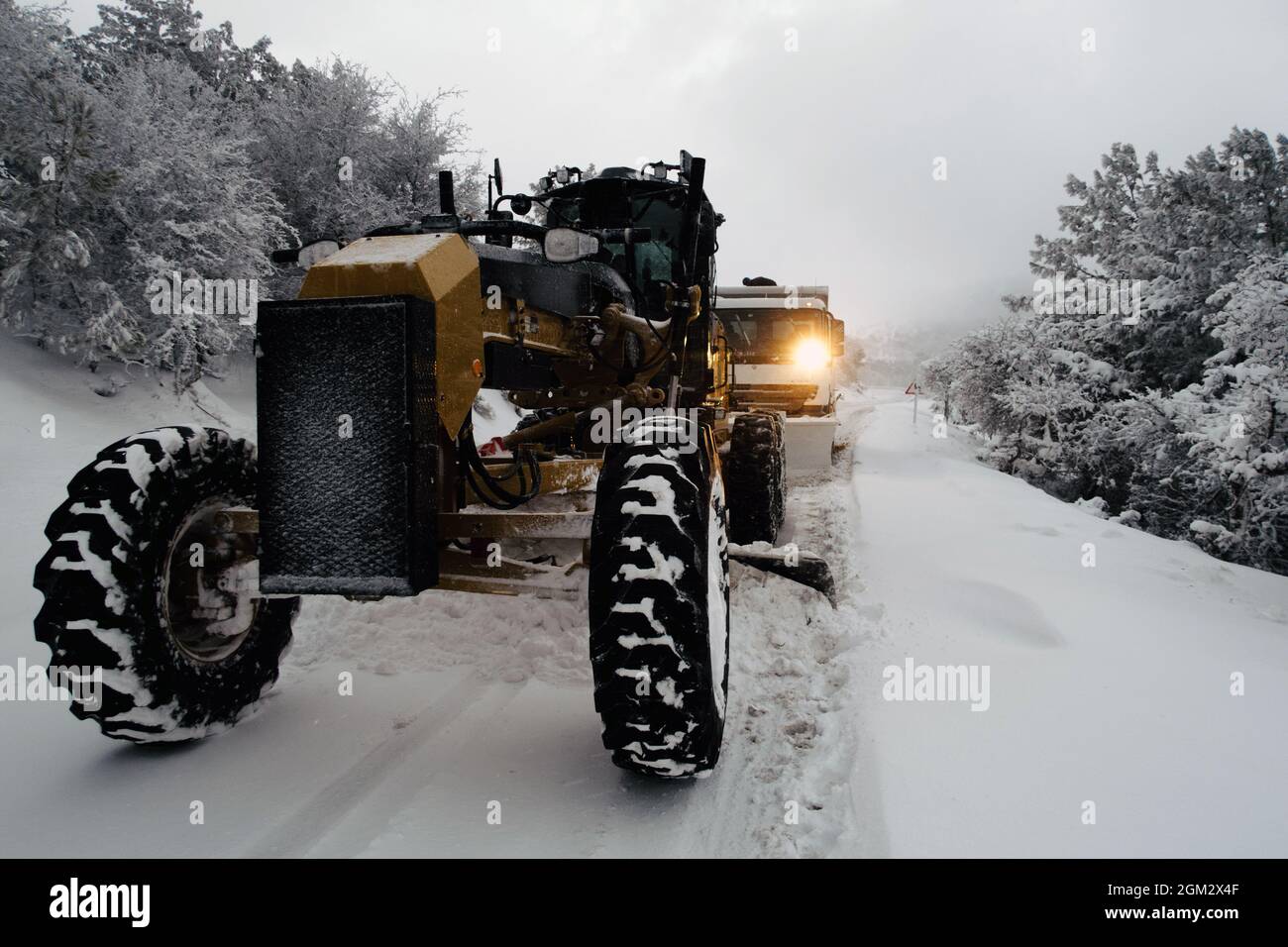 Two big snow trucks clearing snow from the roads Stock Photo - Alamy