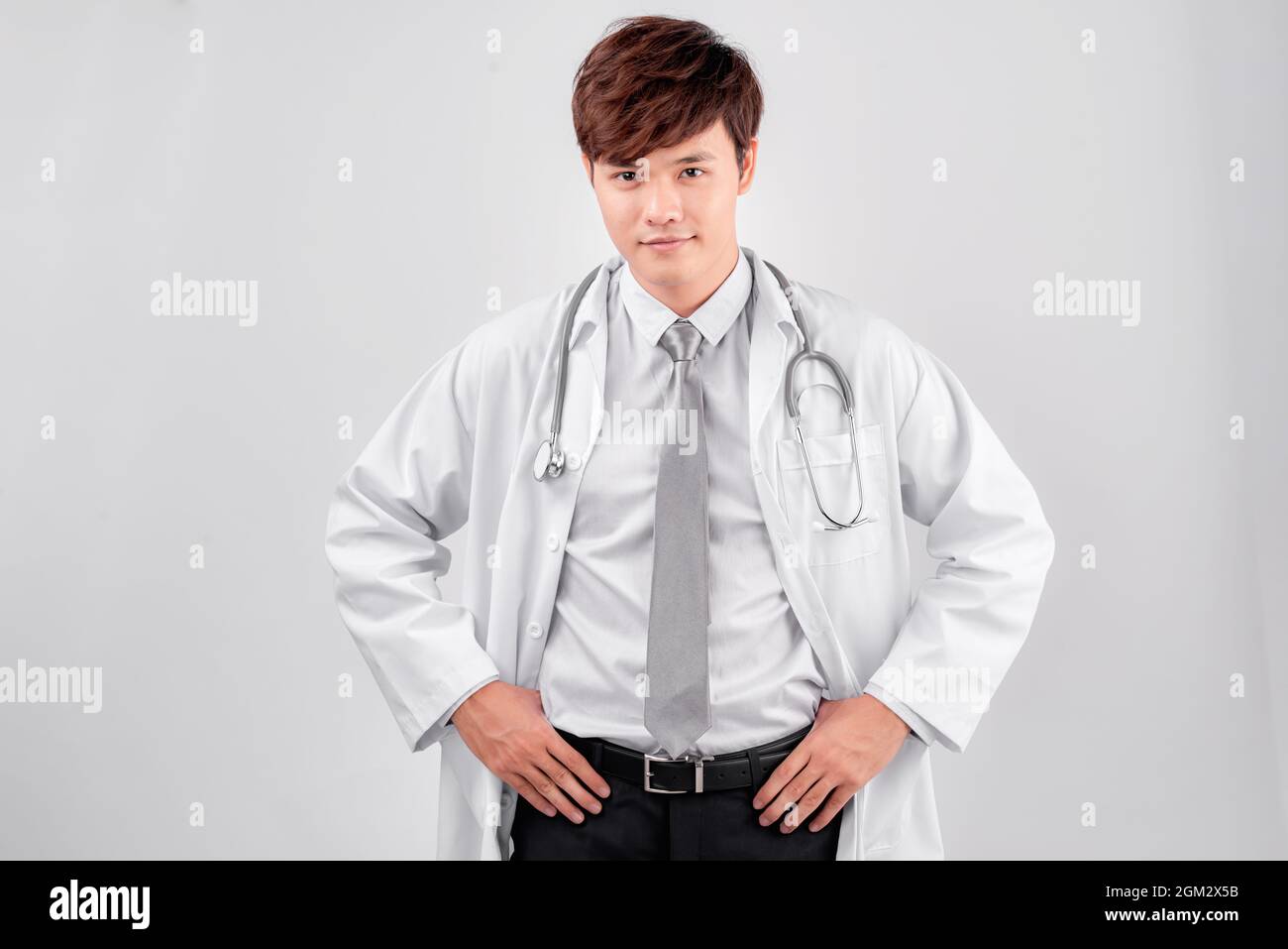 Doctor wearing white coat hi-res stock photography and images - Alamy