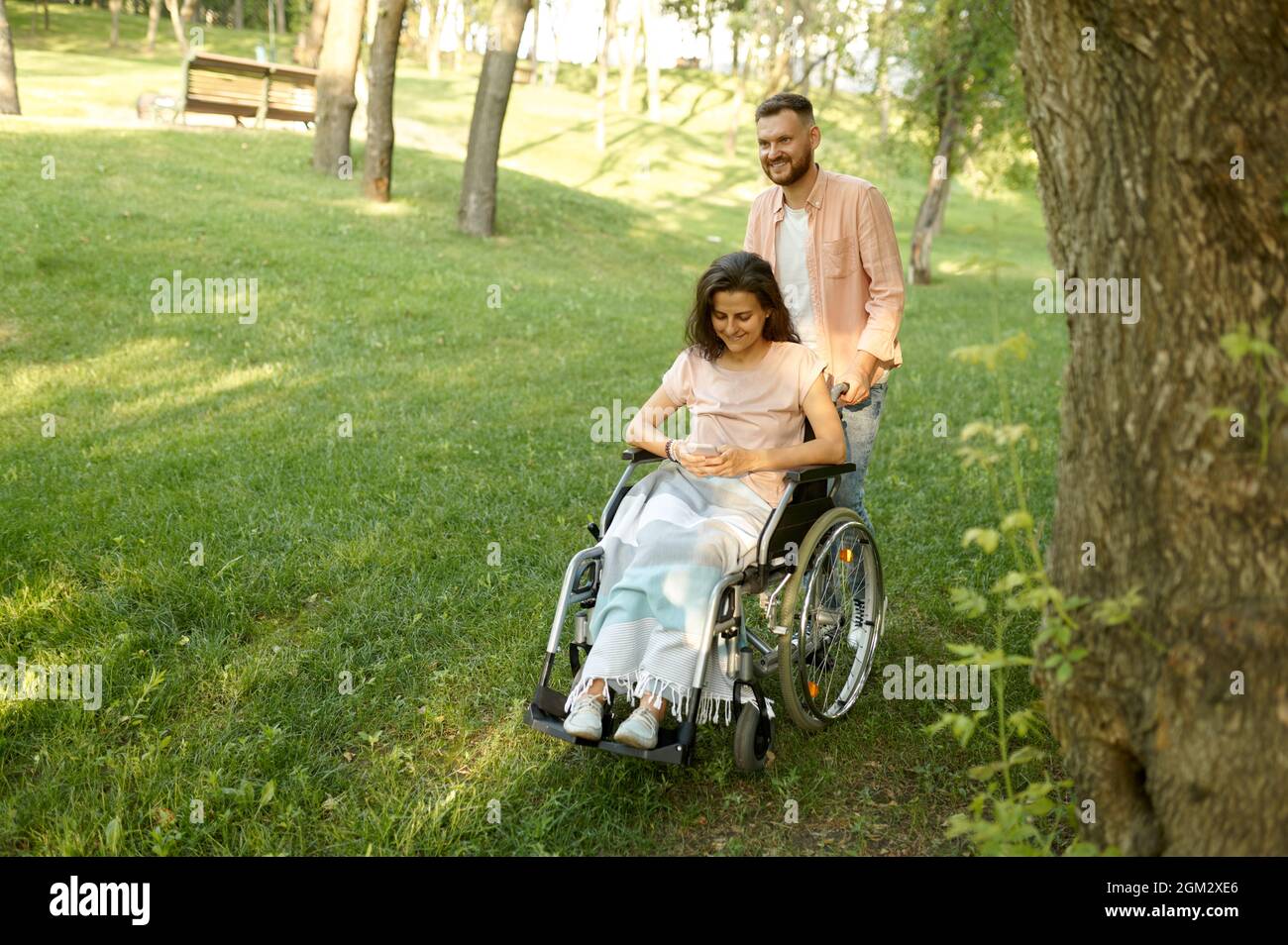 Cheerful love couple wheelchair hi-res stock photography and images - Alamy