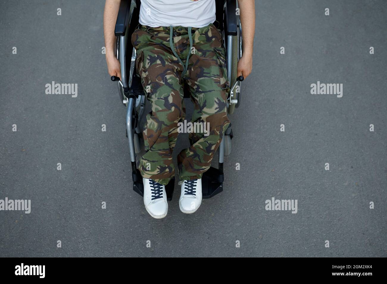 Handicapped military person in wheelchair, top view Stock Photo - Alamy