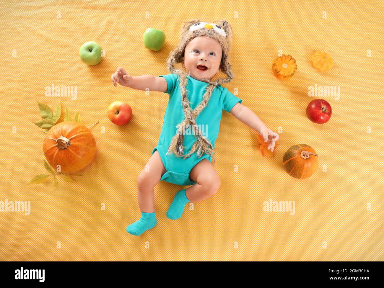 Cute baby, fruits, vegetables and leaves on yellow background Stock ...