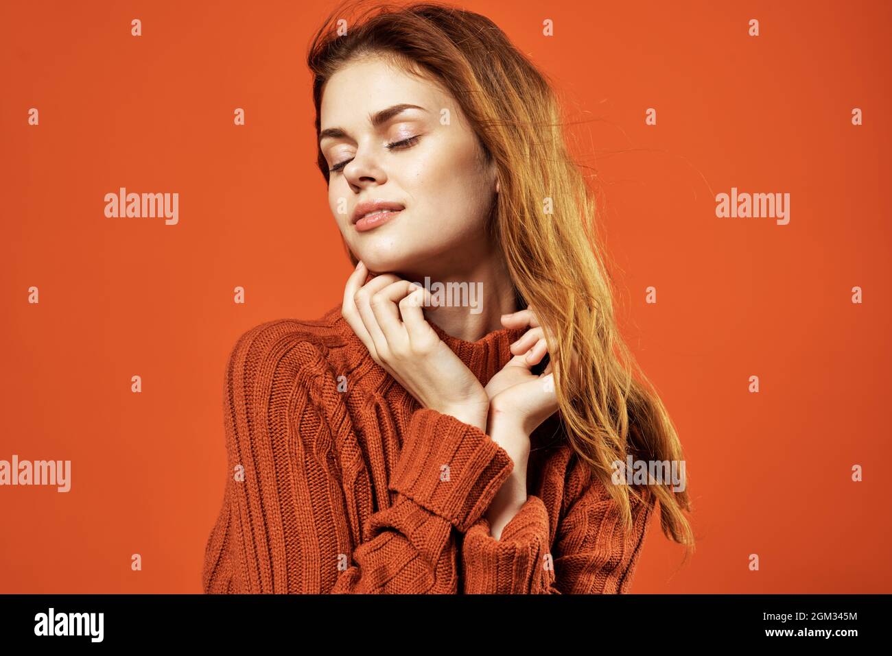 woman in a red sweater beautiful hairstyle fashion lifestyle close-up ...