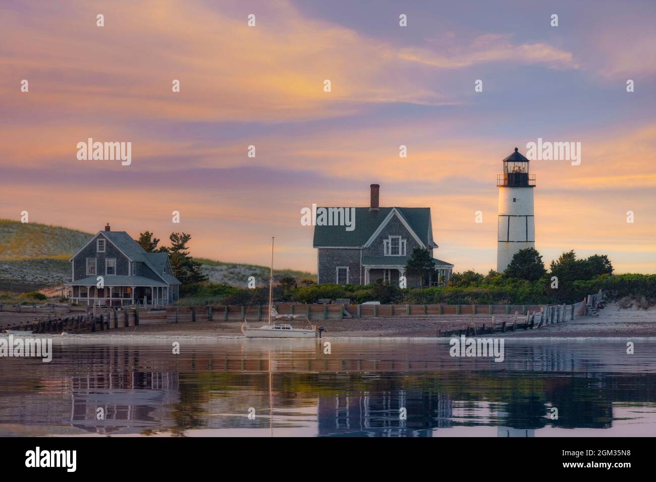 Sandy Neck Light House - Beautiful sunset at Sandy Neck Lighthouse alongside cottages with a ...
