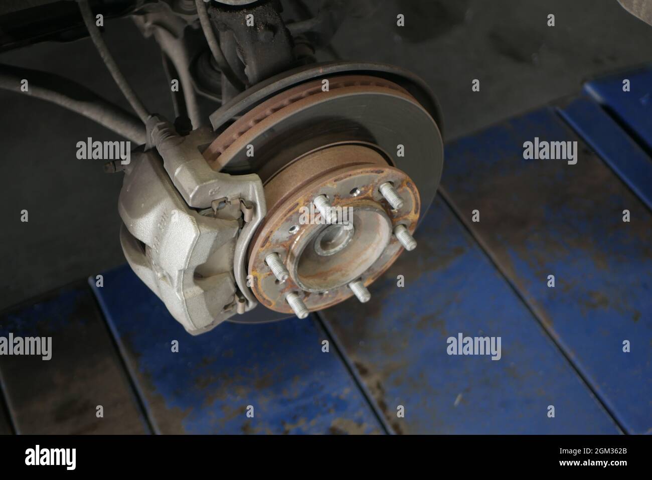 High angle shot of the dissembled vehicle wheel details with brake disk ...