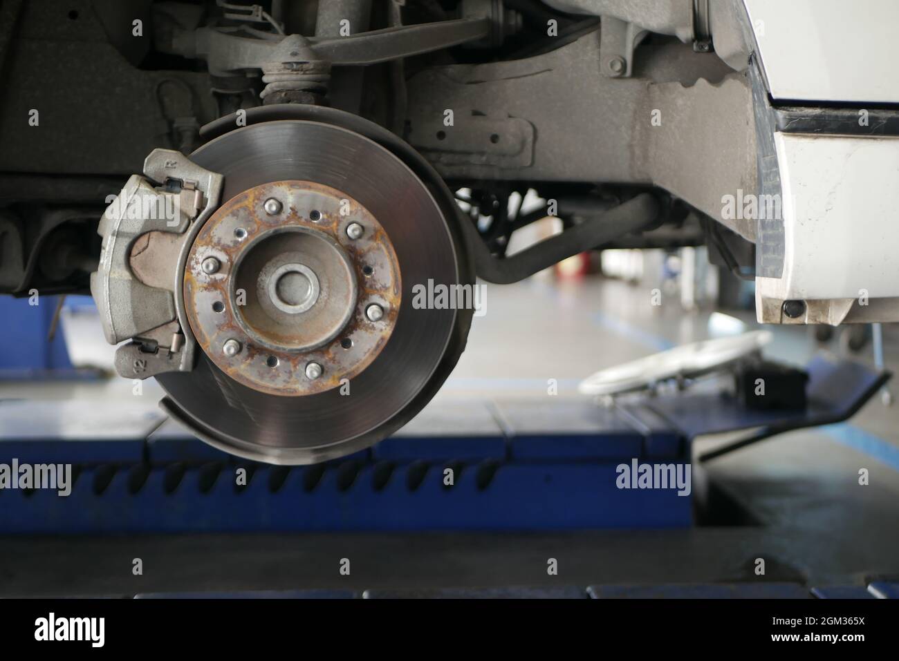 Closeup shot of the dissembled vehicle wheel details with brake disk ...