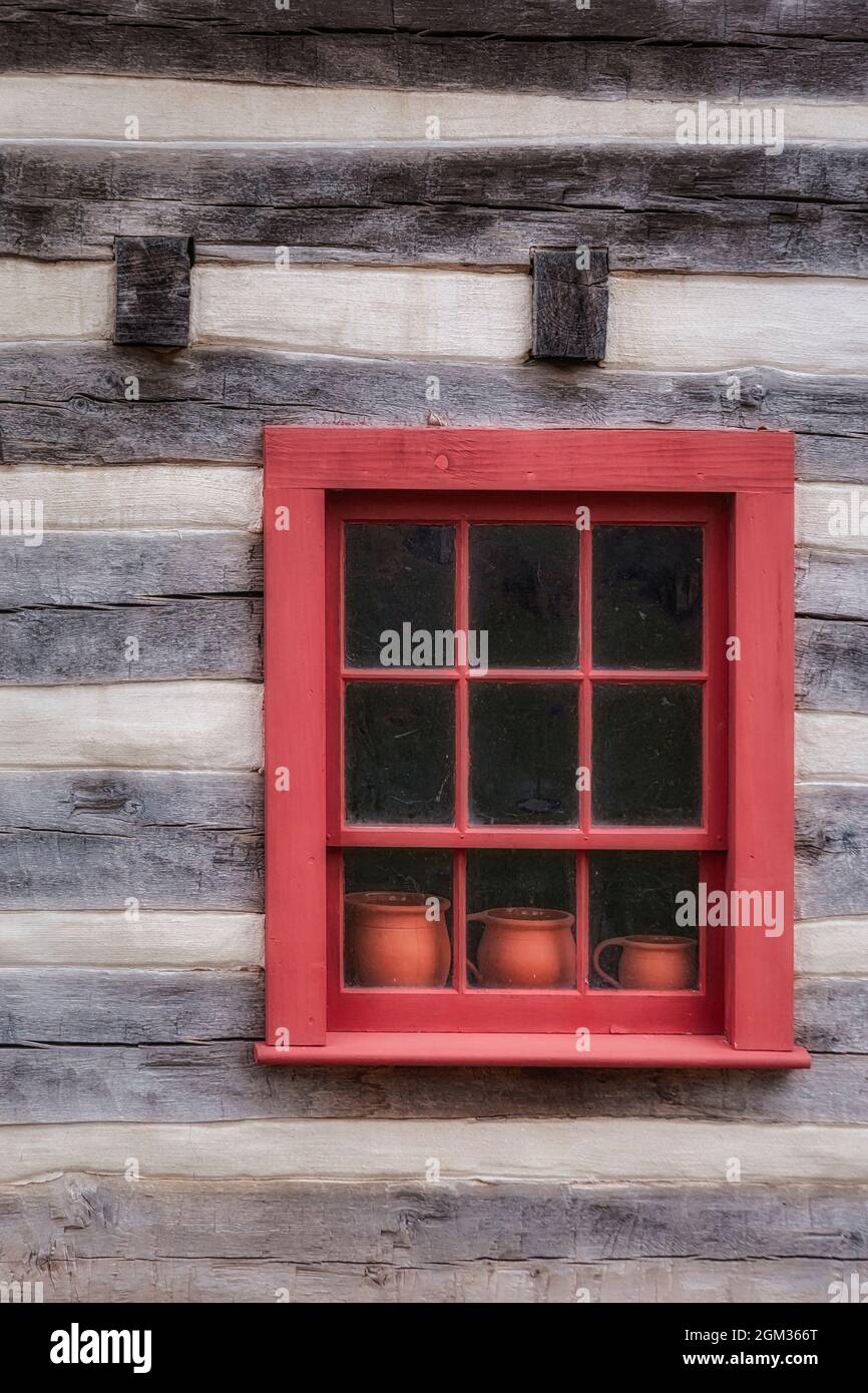 Country Log Cabin - Close view to log cabin details with a red window ...
