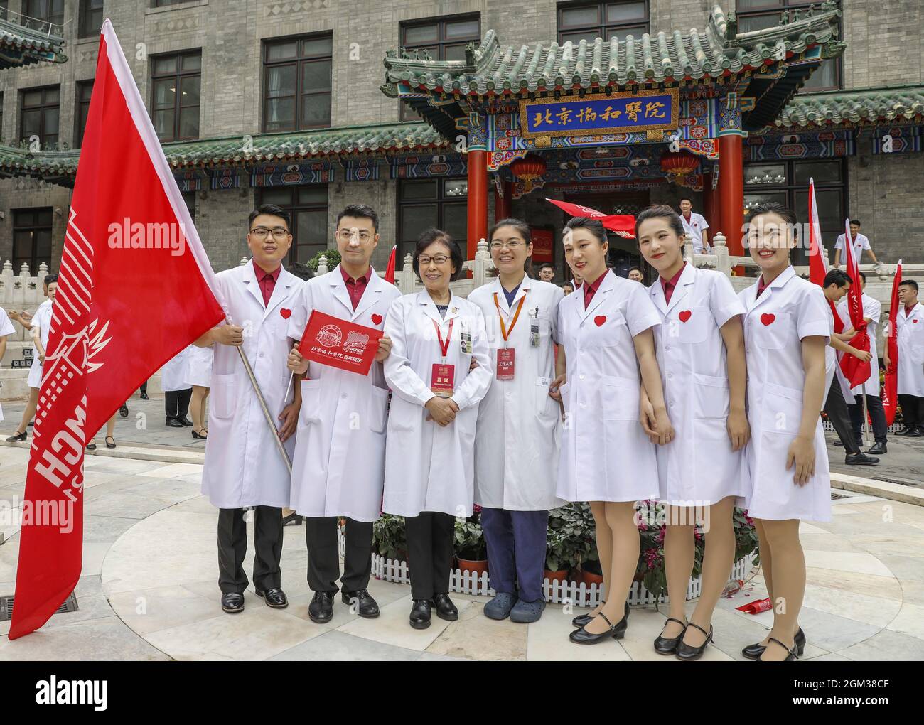 Beijing, China. 16th Sep, 2021. Medical workers pose for photos after a ...