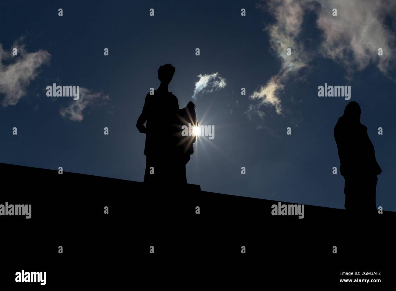 Statues of muses in the Temple of Apollo with sun rays. It is listed as ...
