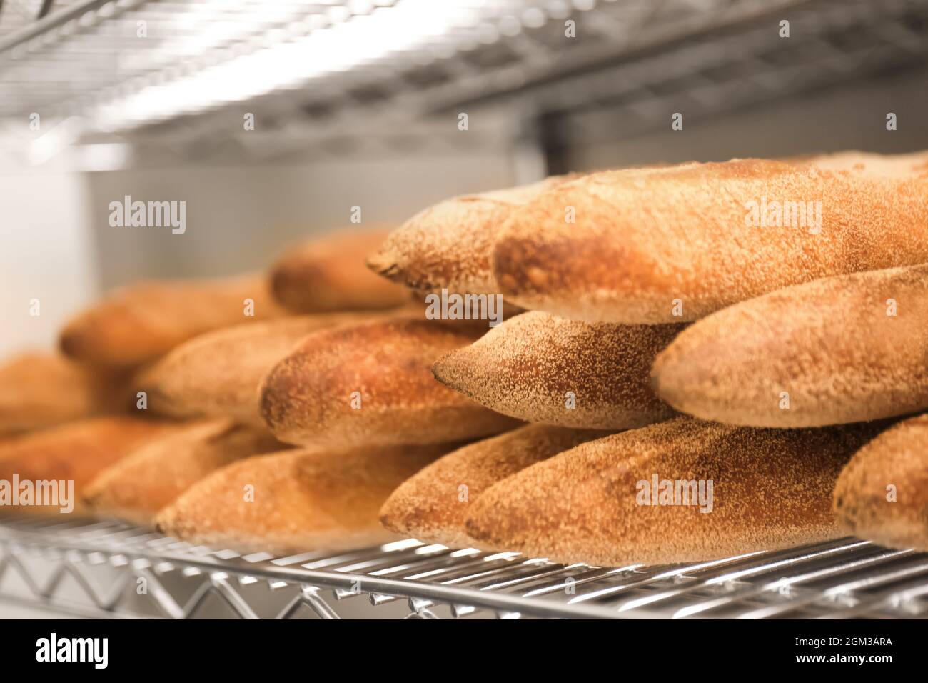 Delicious fresh bread on shelf in bakery Stock Photo - Alamy