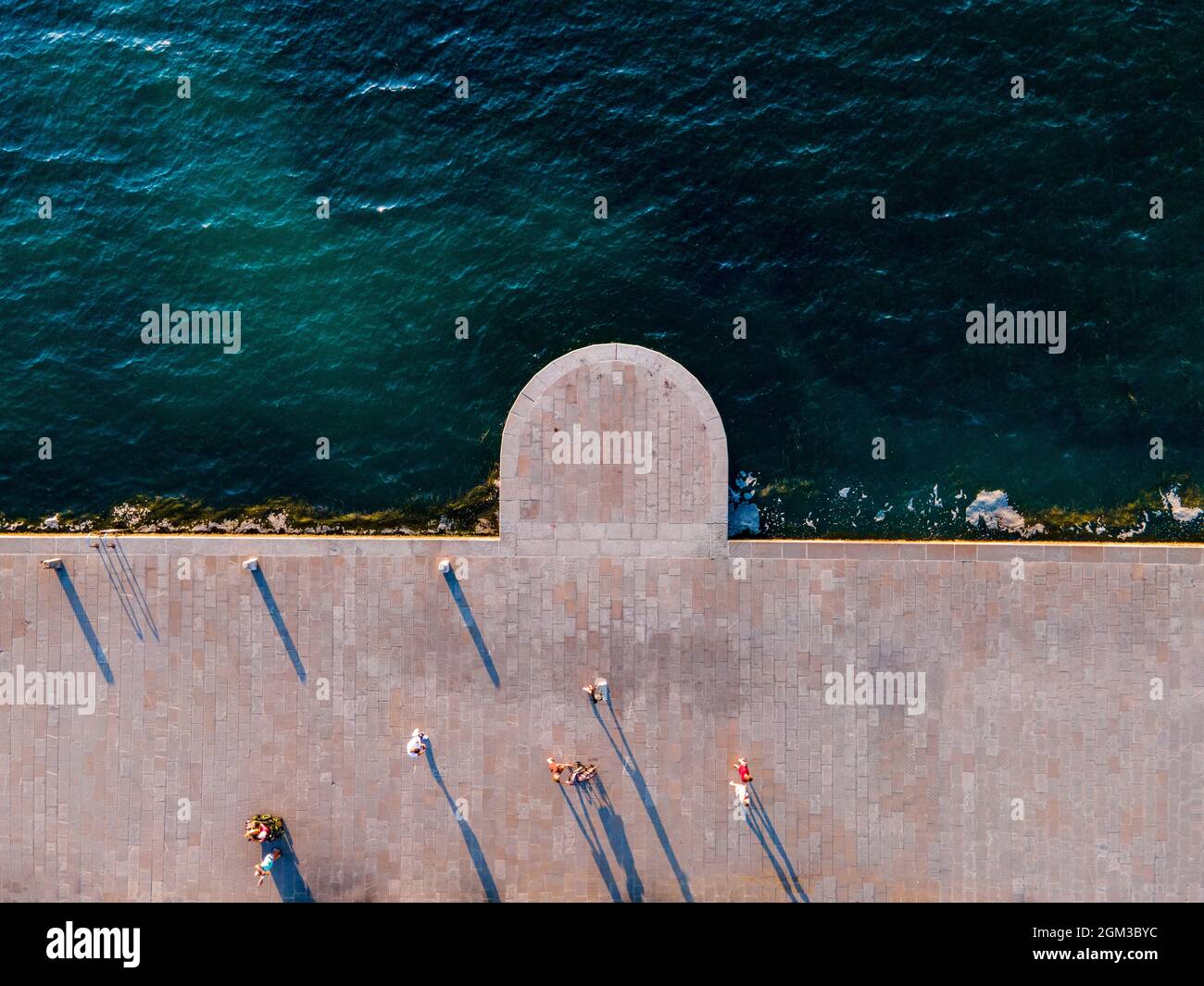 Long Shadows Silhouettes at Sea Pier Top Down Aerial Drone View Stock ...
