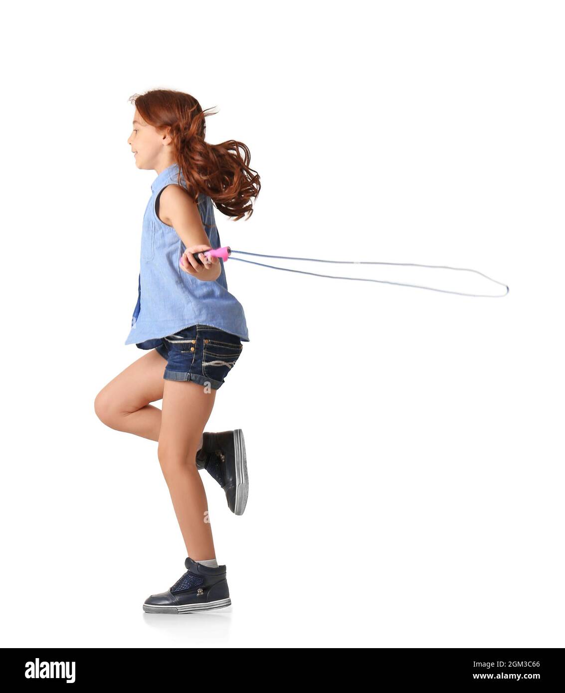 Cute little girl playing with jumping rope on white background Stock ...