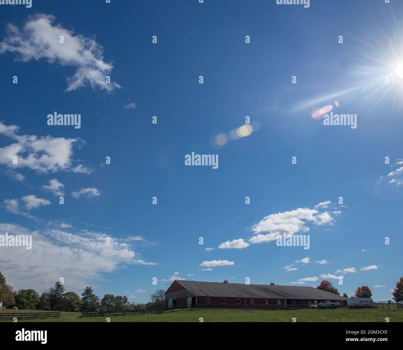 Landscape photo of large barn and blue sky Stock Photo - Alamy