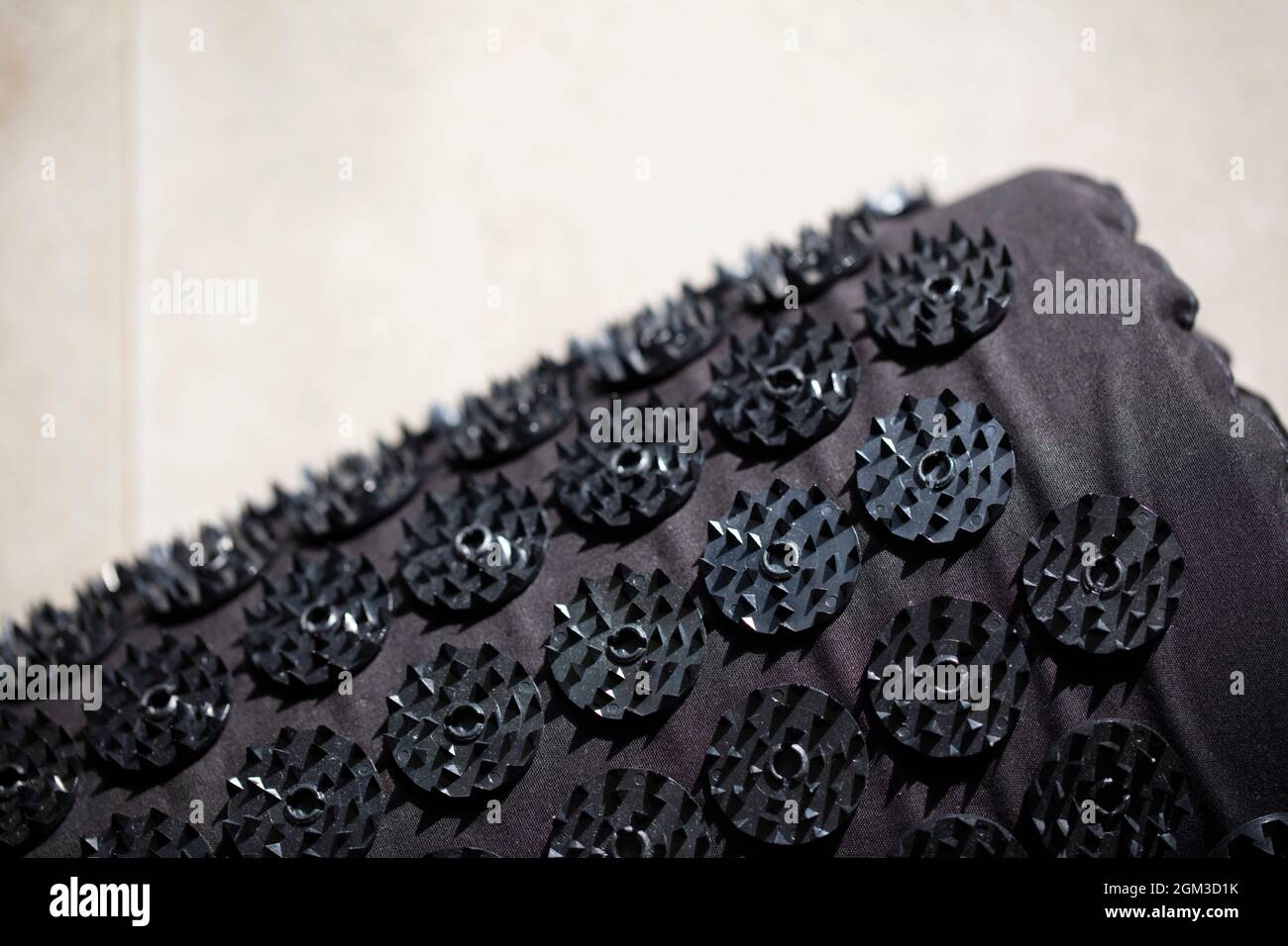 Acupuncture mat with many plastic spikes. Alternative therapy and ...