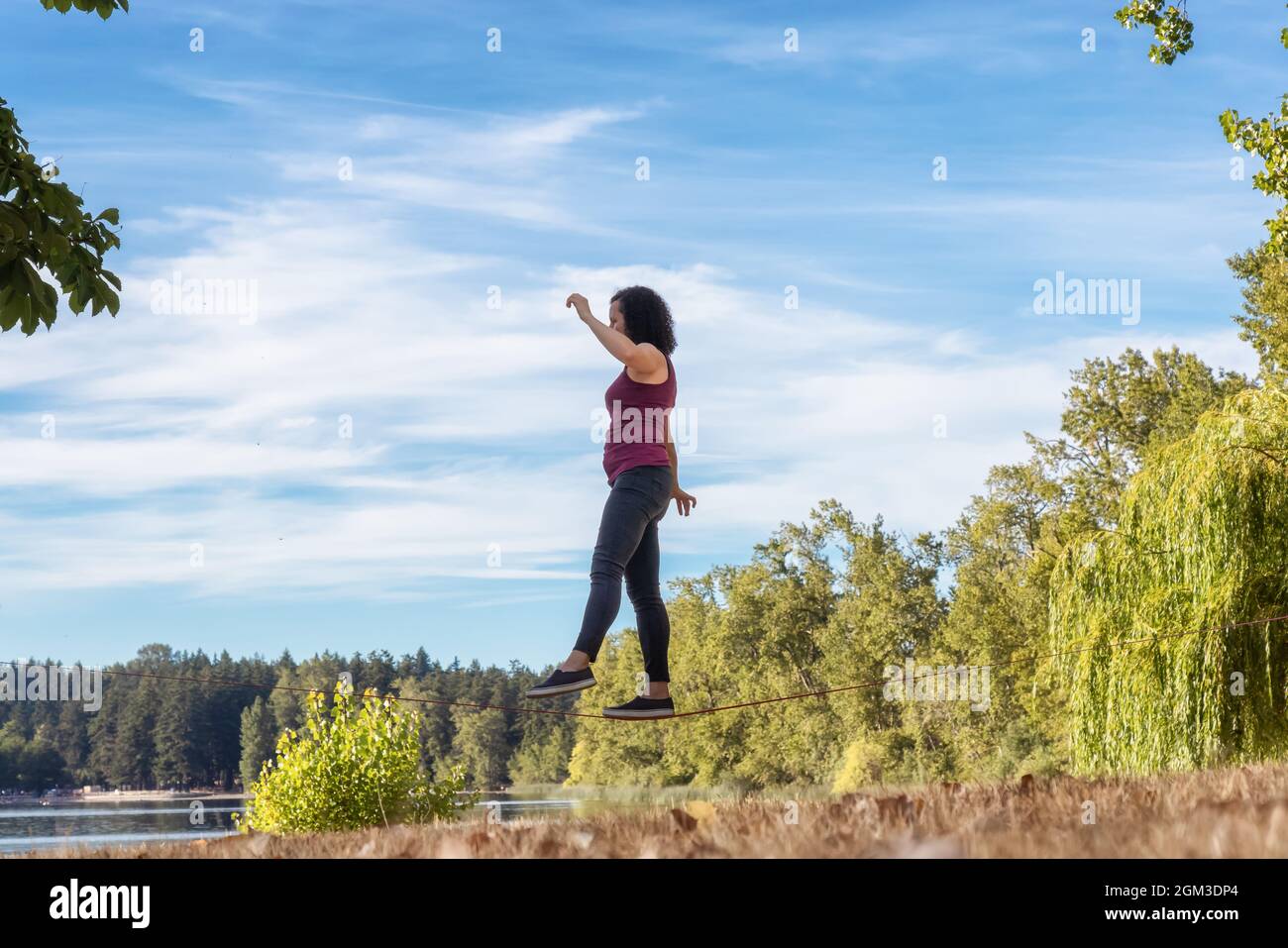 Adventurous White Caucasian Adult Woman Walking on Slackline Stock ...