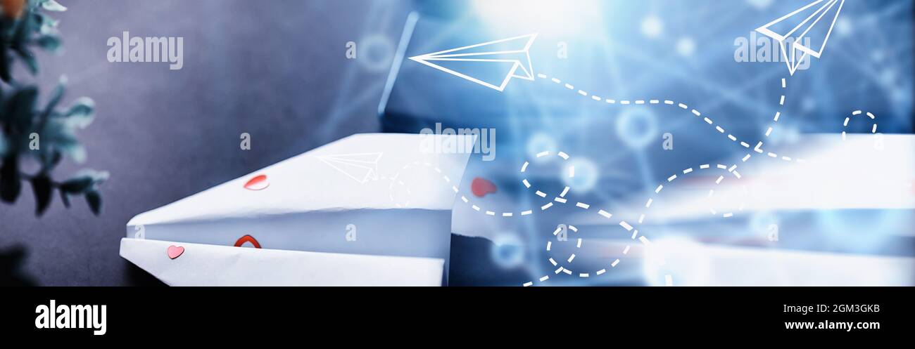 Paper airplane on the table. Origami model on a dark background ...