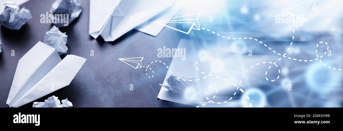 Paper airplane on the table. Origami model on a dark background ...