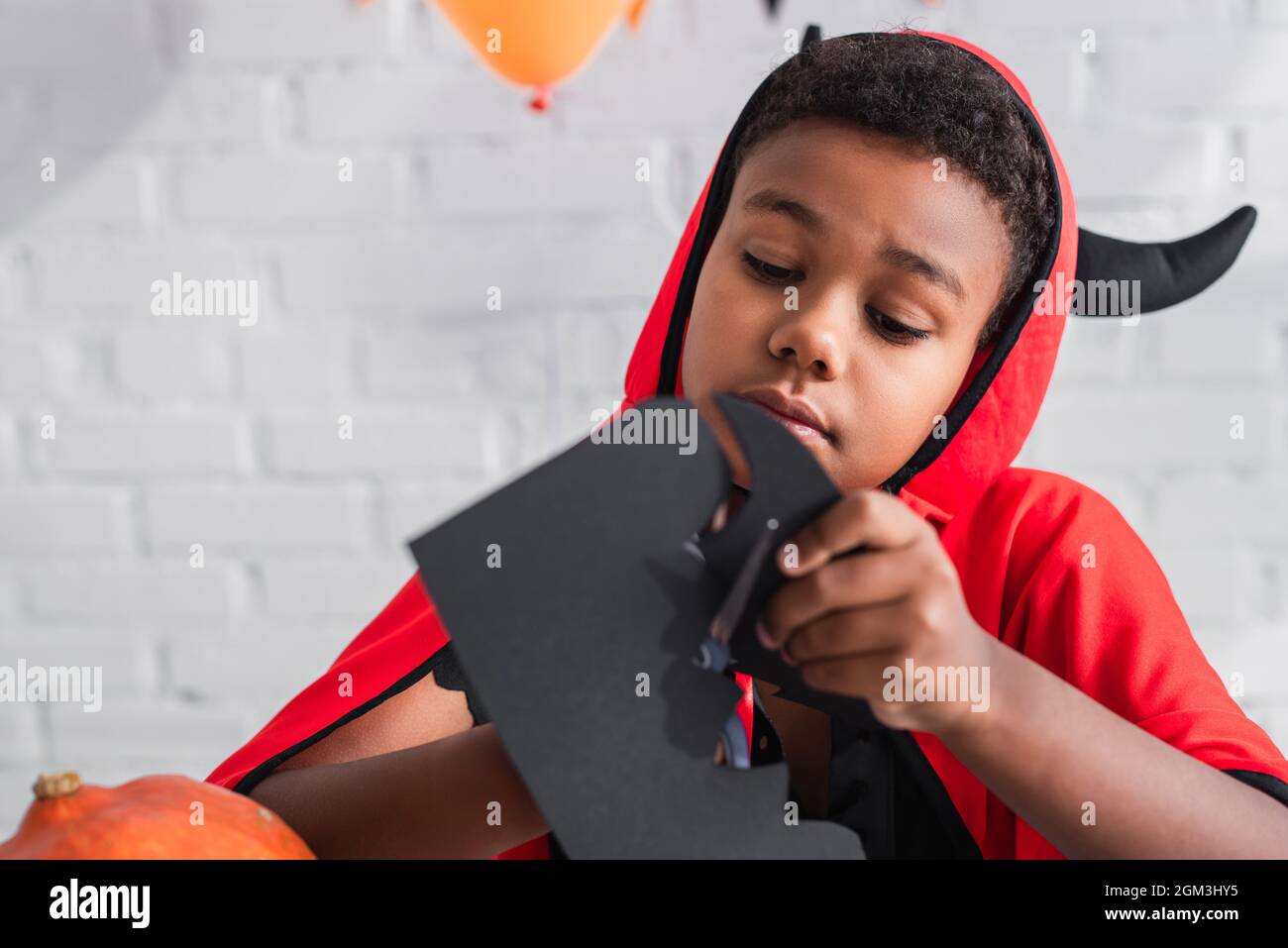 Elementary boy cutting paper scissors hi-res stock photography and ...