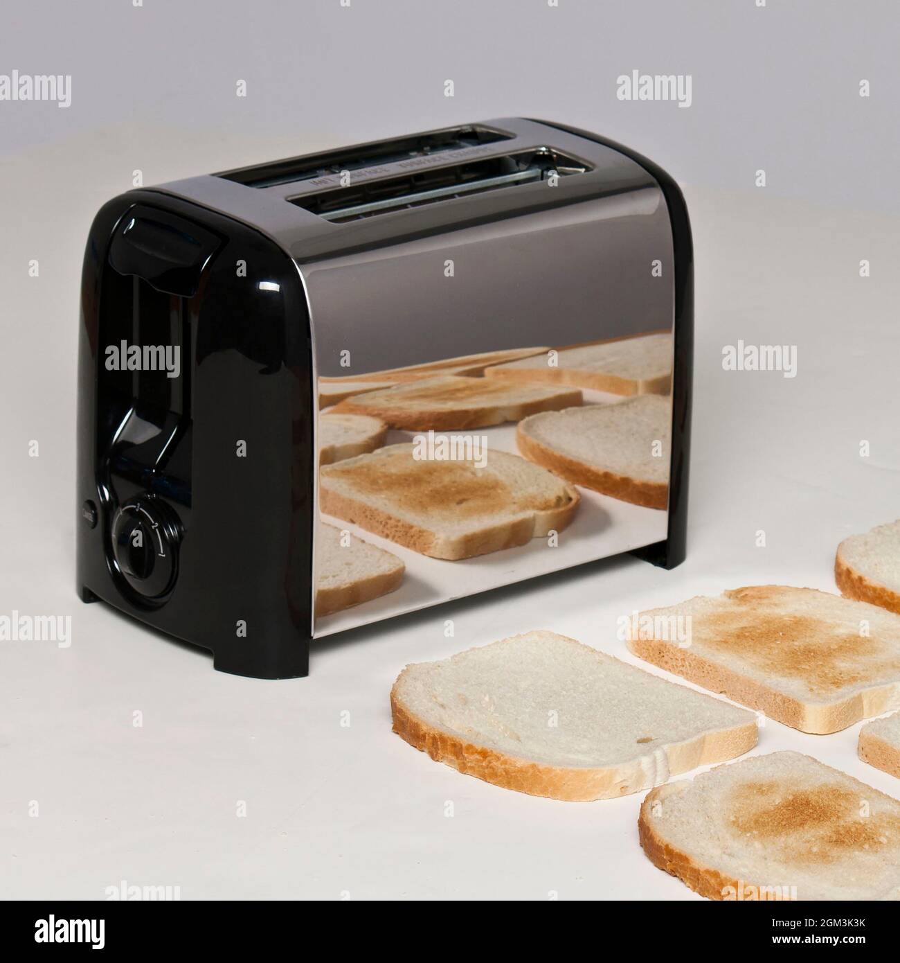 Conceptual image of toaster with bread Stock Photo - Alamy