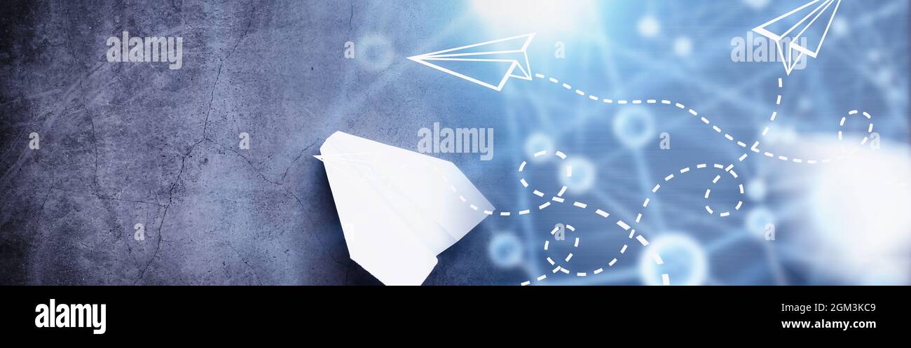 Paper airplane on the table. Origami model on a dark background ...