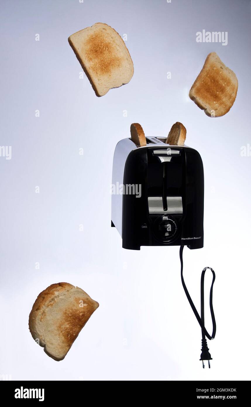 Conceptual product photography of toast popping out of a toaster Stock ...