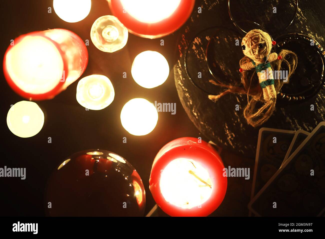 Mystic still life with voodoo doll, the tarot cards, books, evil ...