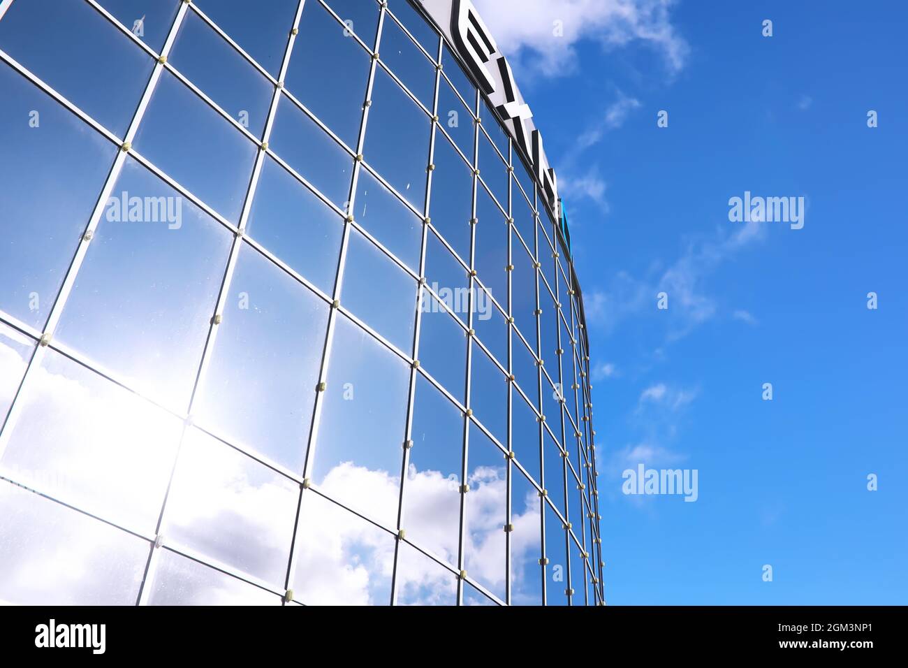 Architectural detail of the facade with multiple reflections of other ...