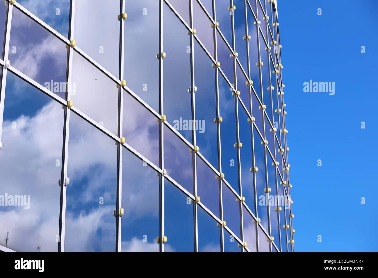 Architectural detail of the facade with multiple reflections of other ...
