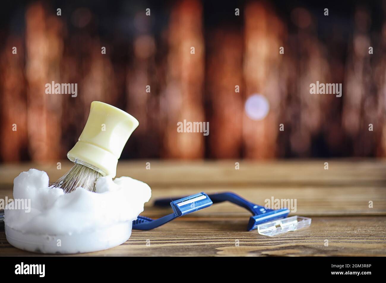 Shaving accessories on a wooden texture background. Tools. Disposable ...