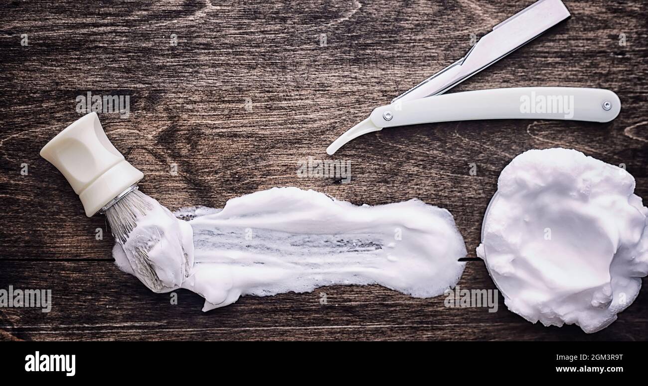 Shaving accessories on a wooden texture background. Tools. Disposable ...