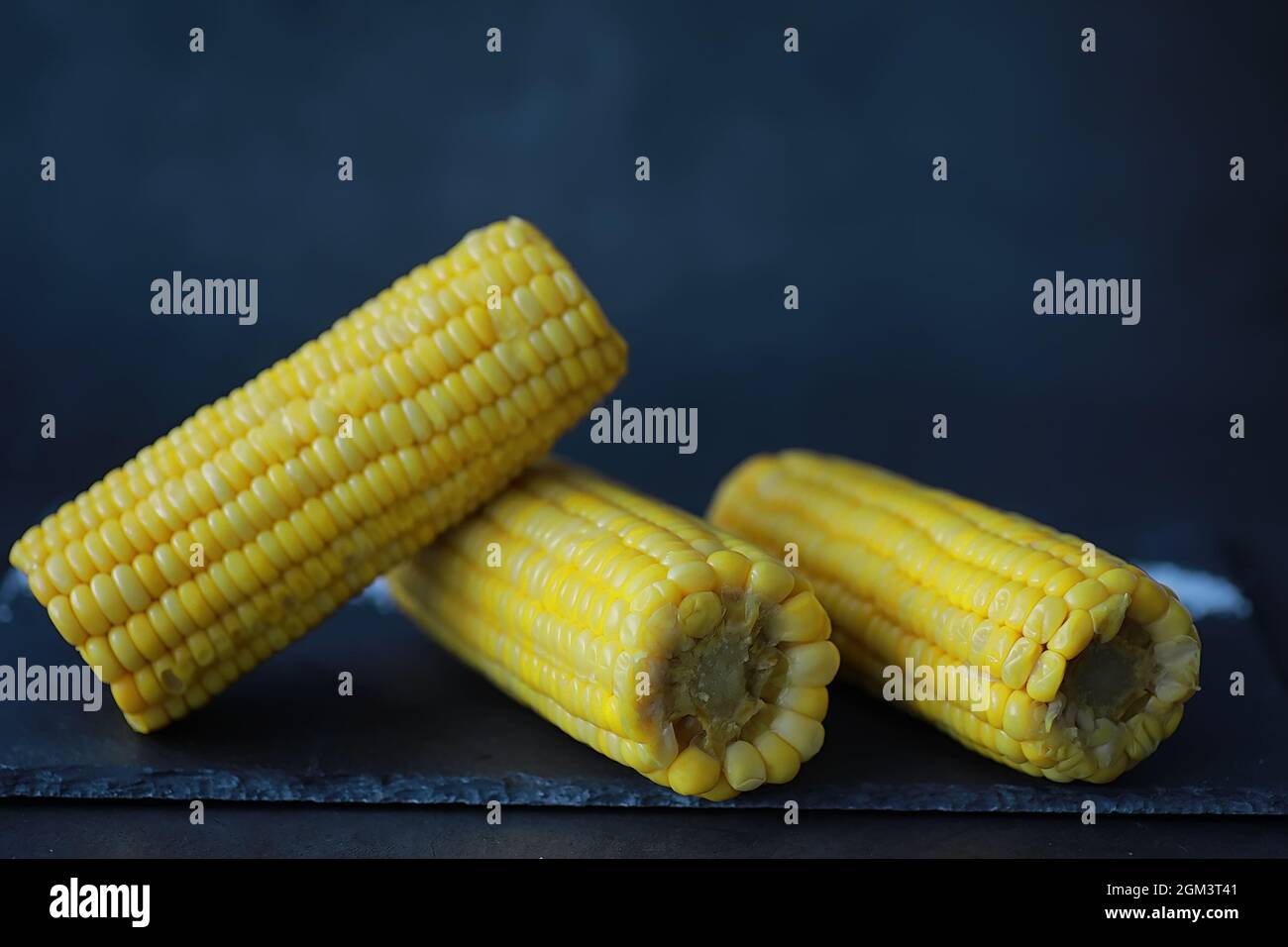 Freshly made fragrant ear of corn with salt. Farm snack fresh corn ...