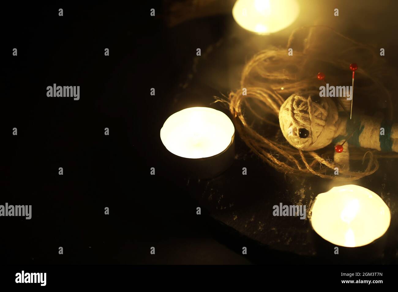 Mystic still life with voodoo doll, the tarot cards, books, evil ...